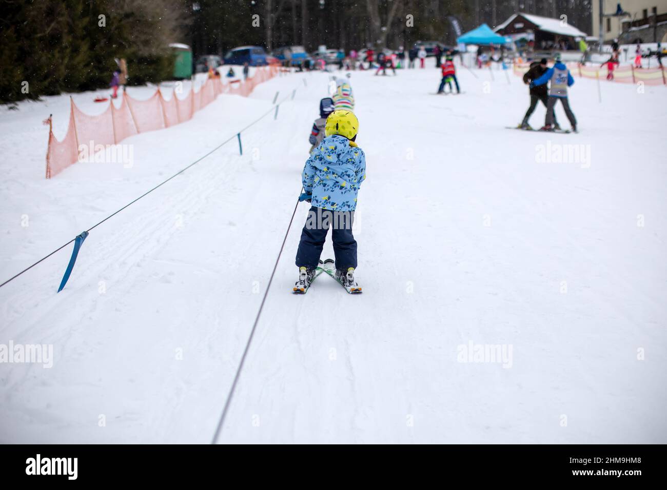 Little toddler boy, preschool child, skiing for the first time on small ...