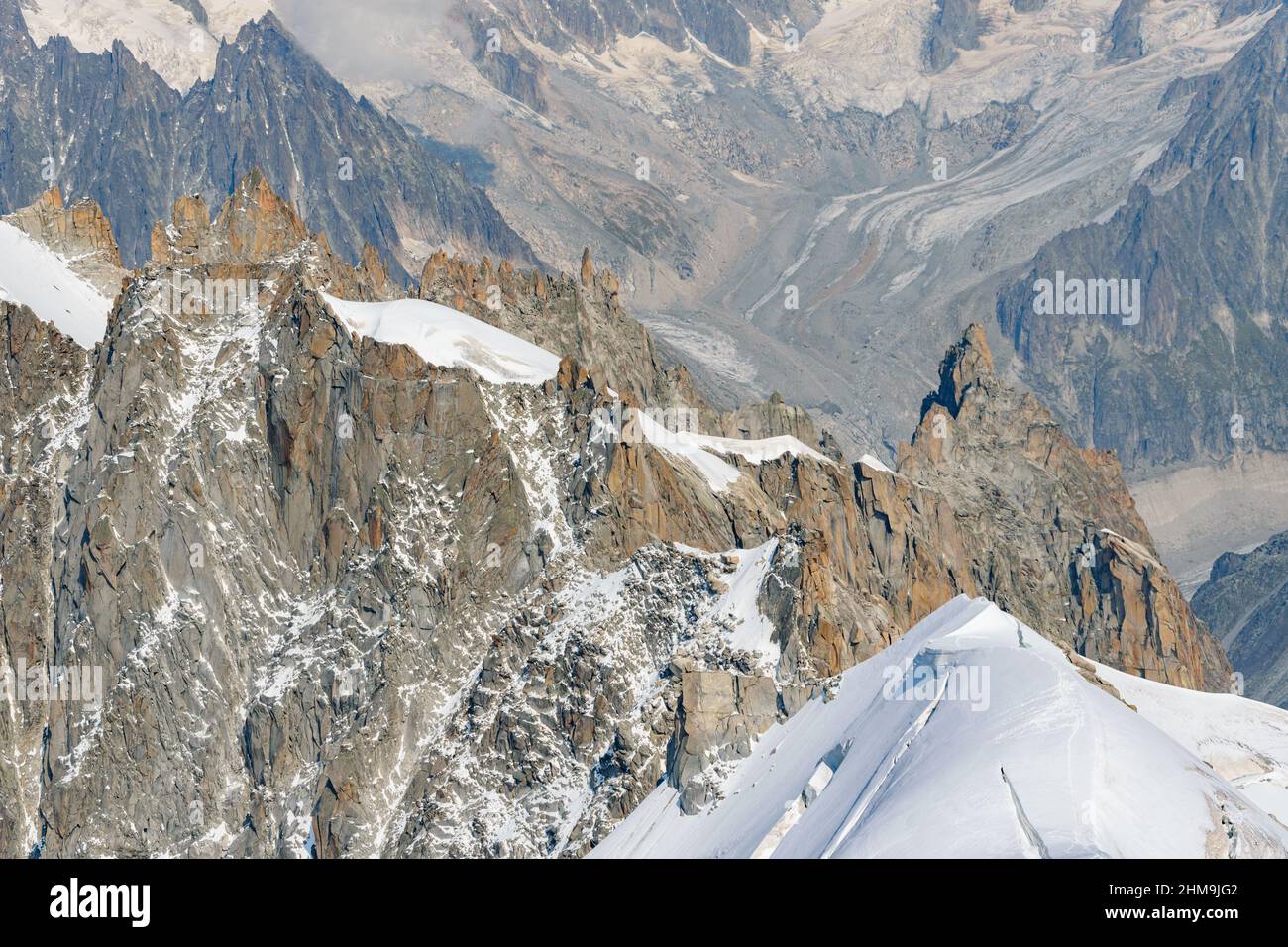 Alpine views from Aiguille du Midi viewing platform above Chamonix underneath Mont Blanc Stock ...