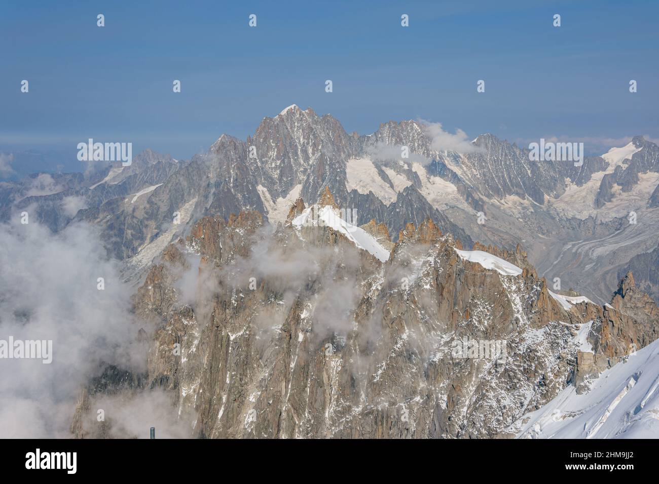 Alpine views from Aiguille du Midi viewing platform above Chamonix underneath Mont Blanc Stock ...