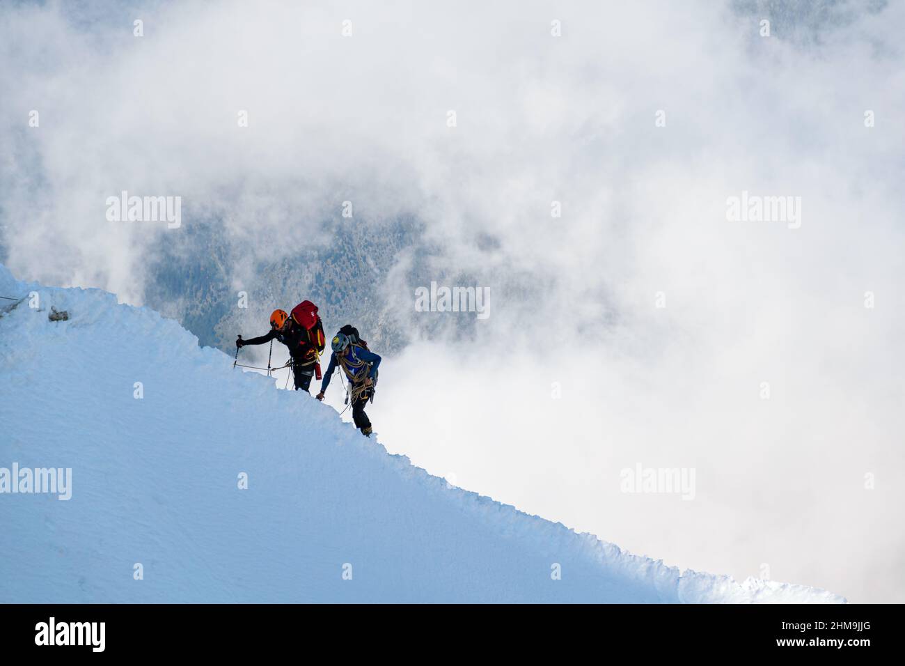 Climbing to the Aiguille du Midi viewing platform above Chamonix ...
