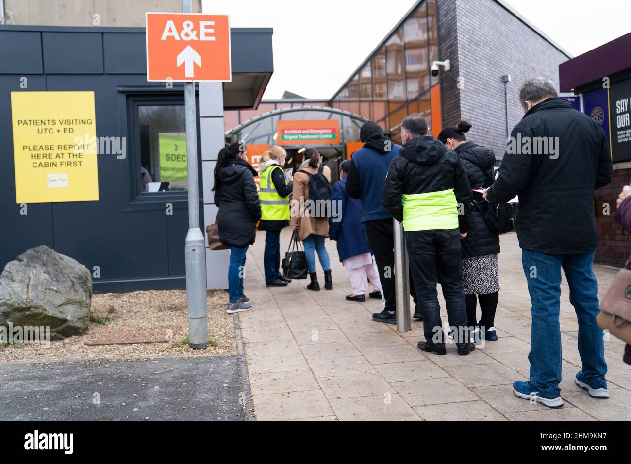 Patients queue outside the Accident and Emergency department at ...