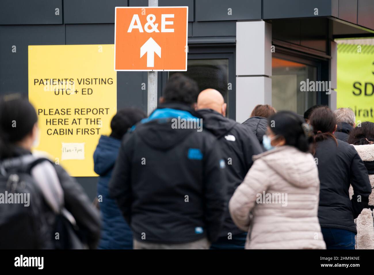 Patients queue outside the Accident and Emergency department at ...