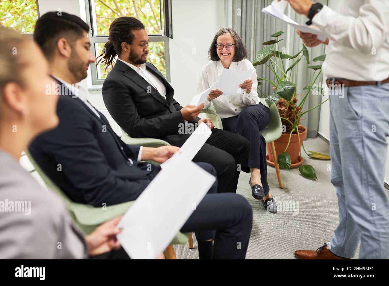 Young trainees in the selection seminar in the assessment center with a ...