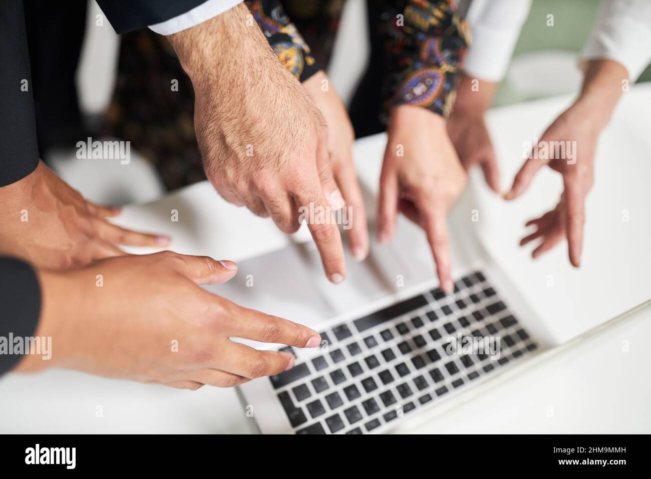 Many fingers point to the computer keyboard as a symbol for internet ...