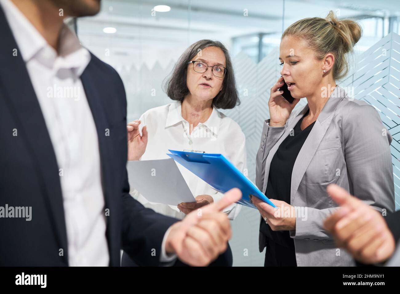 Business people in business start-up team discussing project planning ...