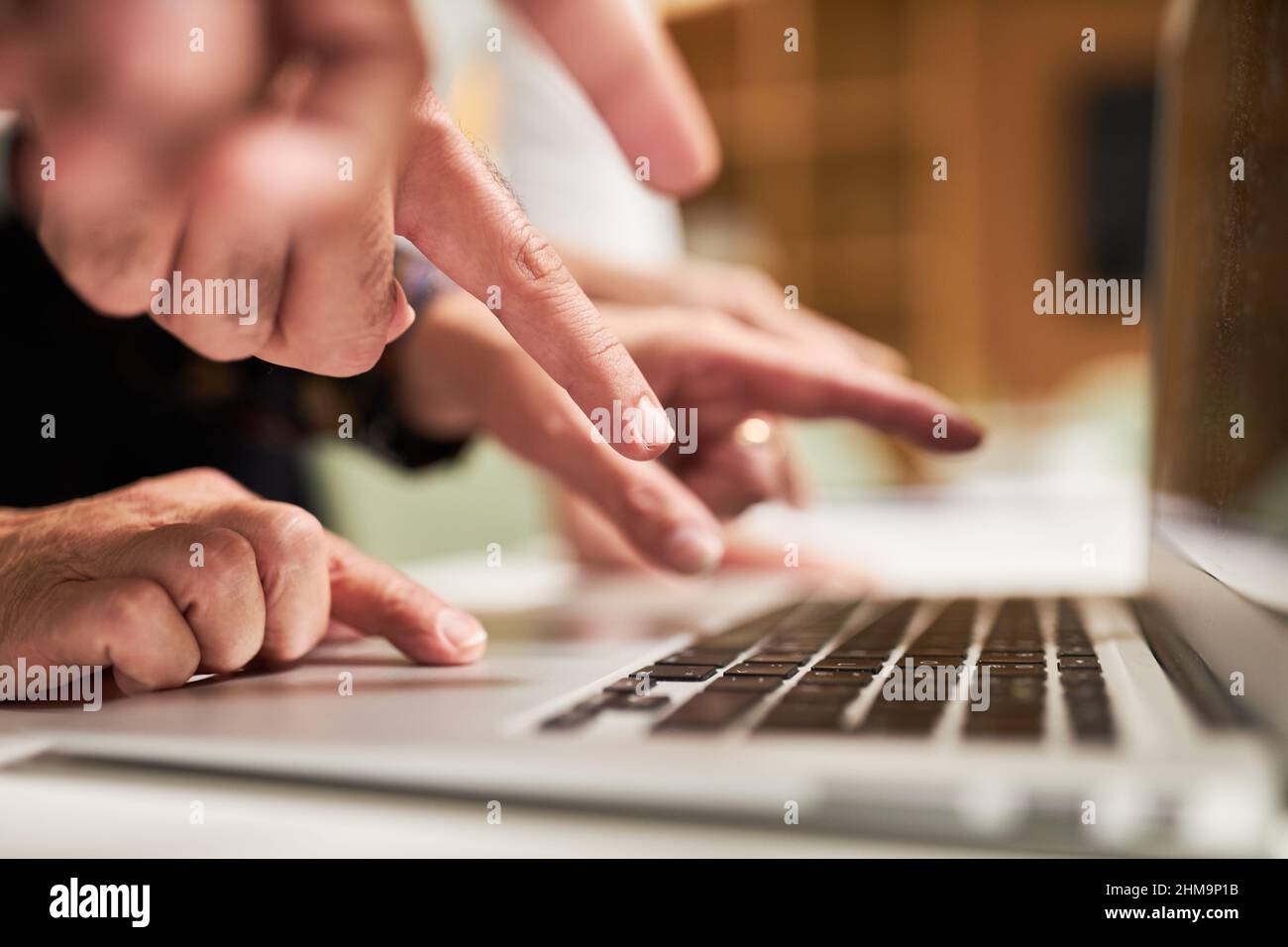 Finger pointing at keyboard on laptop computer symbolizing internet and ...