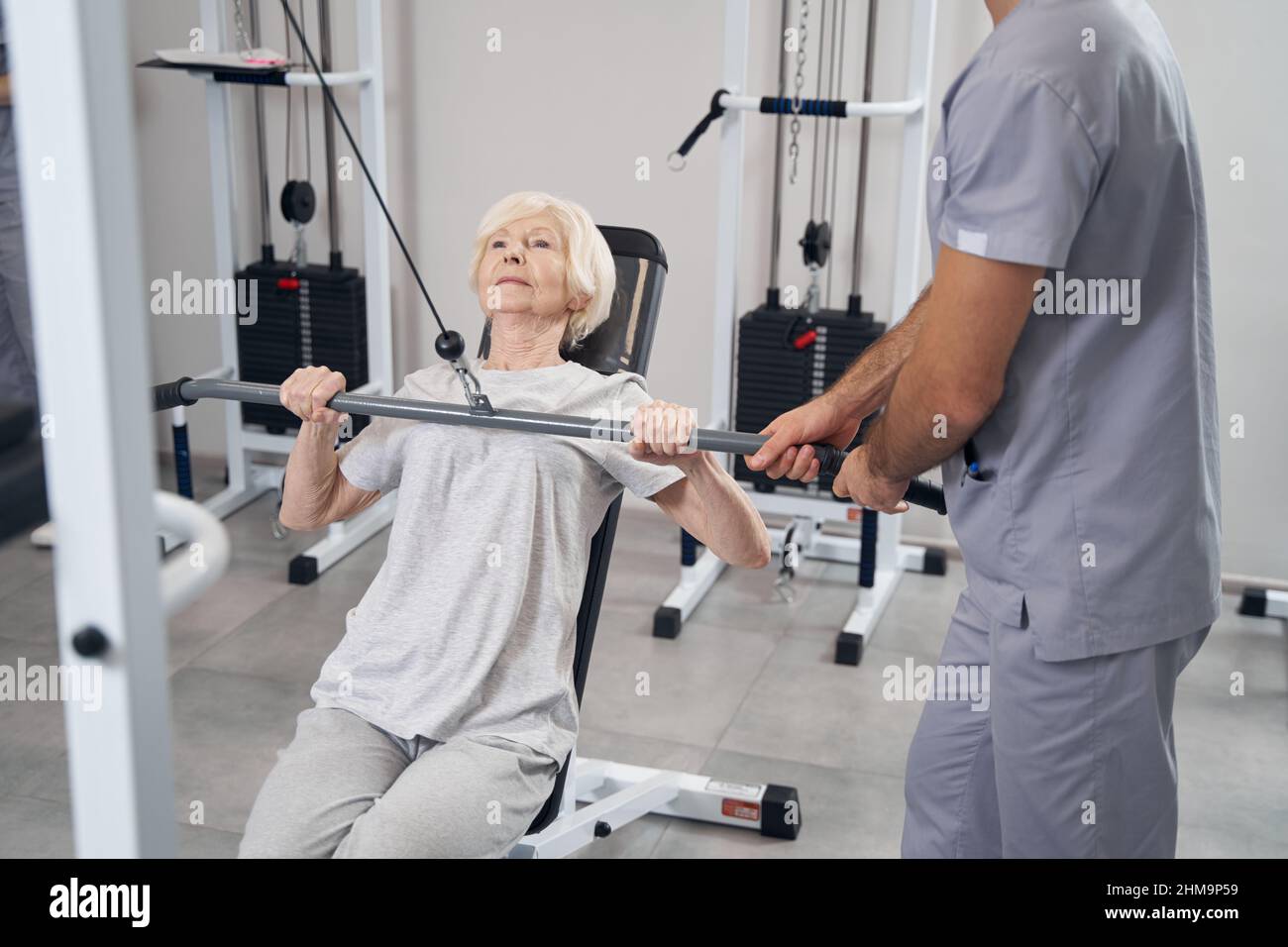 Weight training pulley hi-res stock photography and images - Alamy