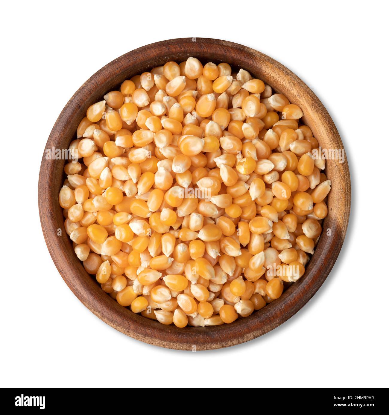 Dried corn or popcorn grains in a bowl isolated over white background ...