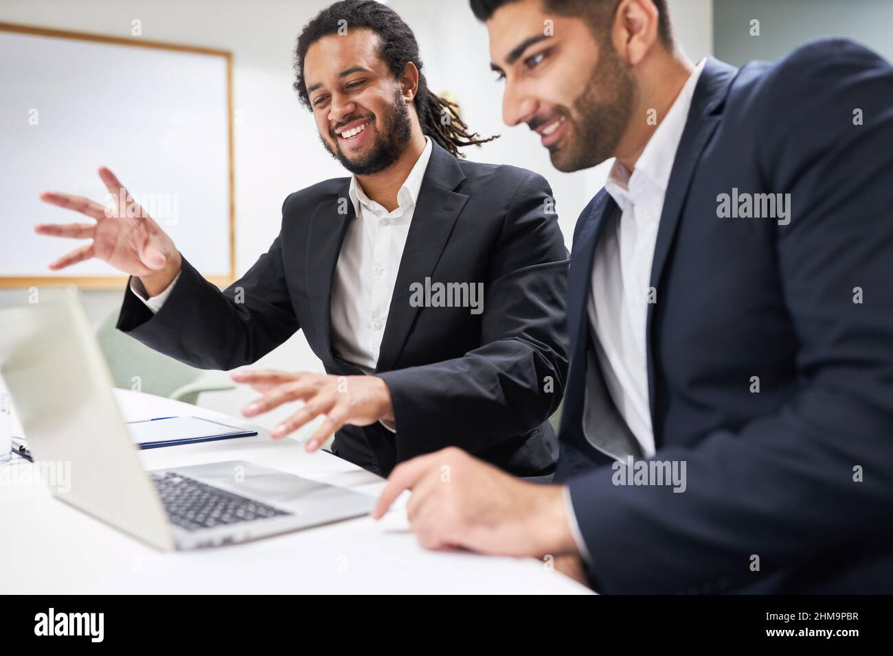 Two business people in the start-up creative team have an idea or ...