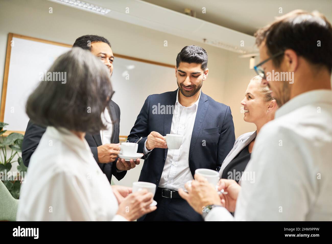 Group of business people having a coffee break after the meeting having ...