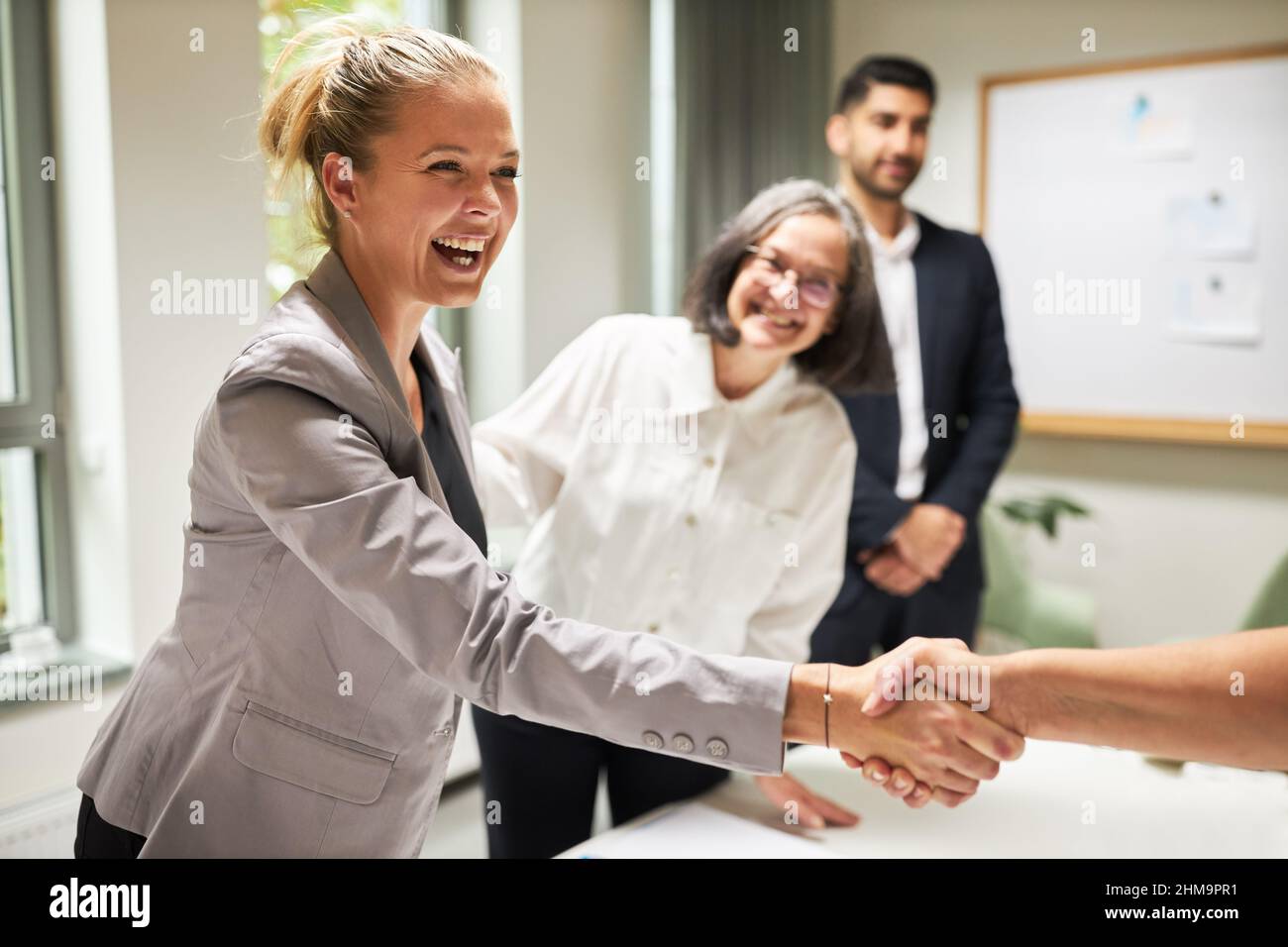 Young business man handshake as a symbol of promotion and ...