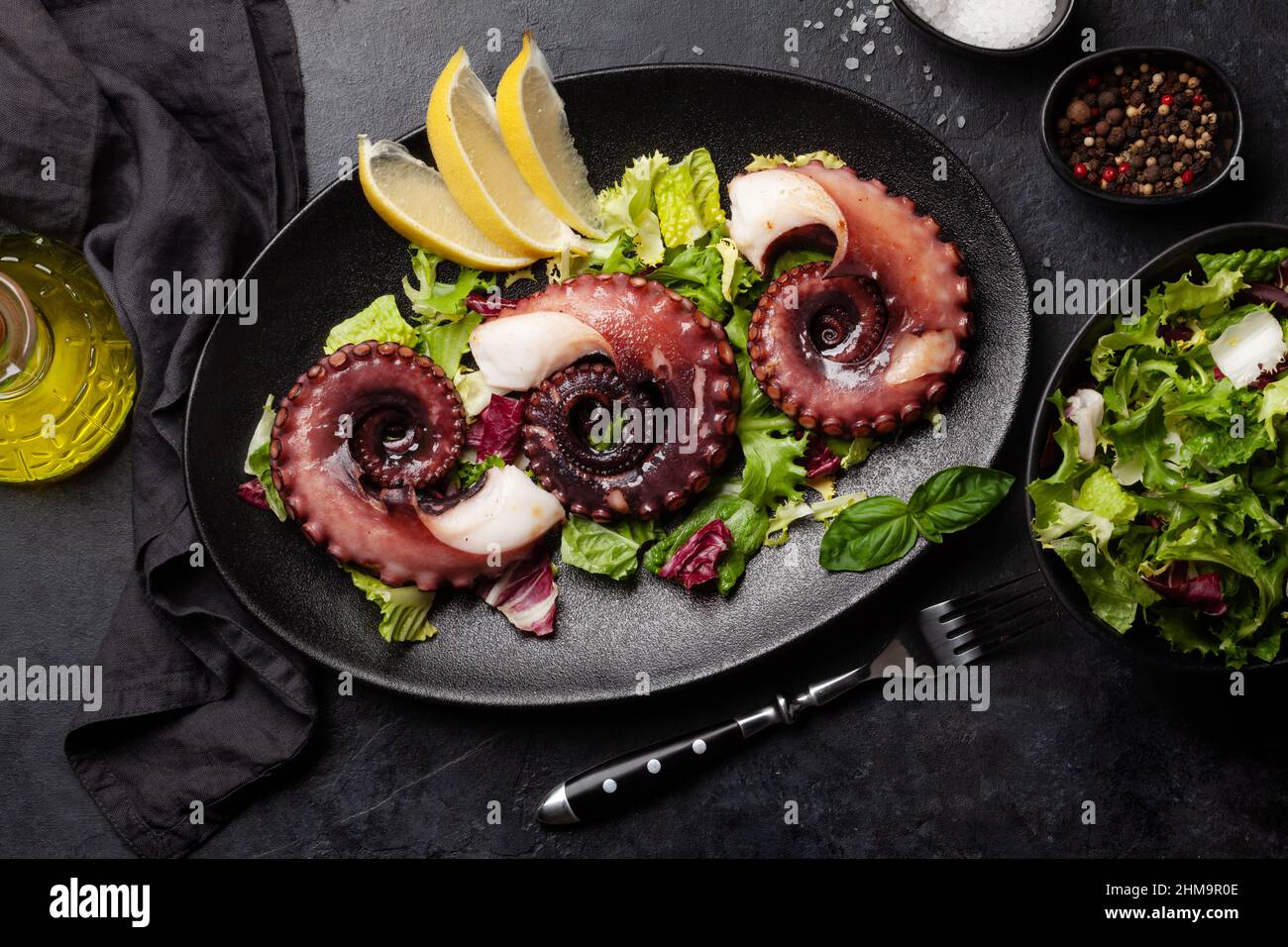 Grilled octopus and salad. Top view flat lay Stock Photo - Alamy