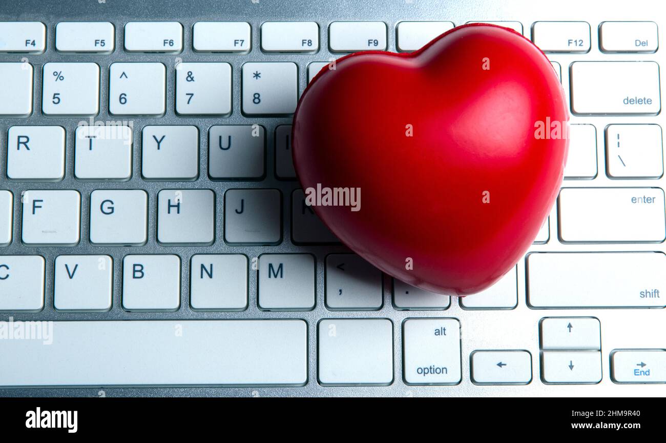 red heart on pc keyboard of notebook website Stock Photo - Alamy