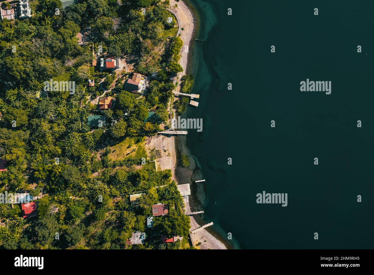 Birds eye view shot of Lake Atitlan and the coast with houses Stock ...
