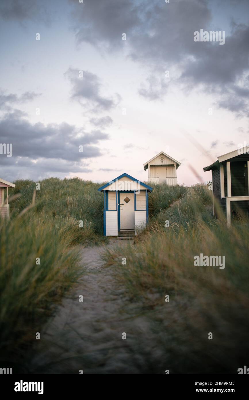 View of colorful changing houses near a beach on a cloudy day Stock ...