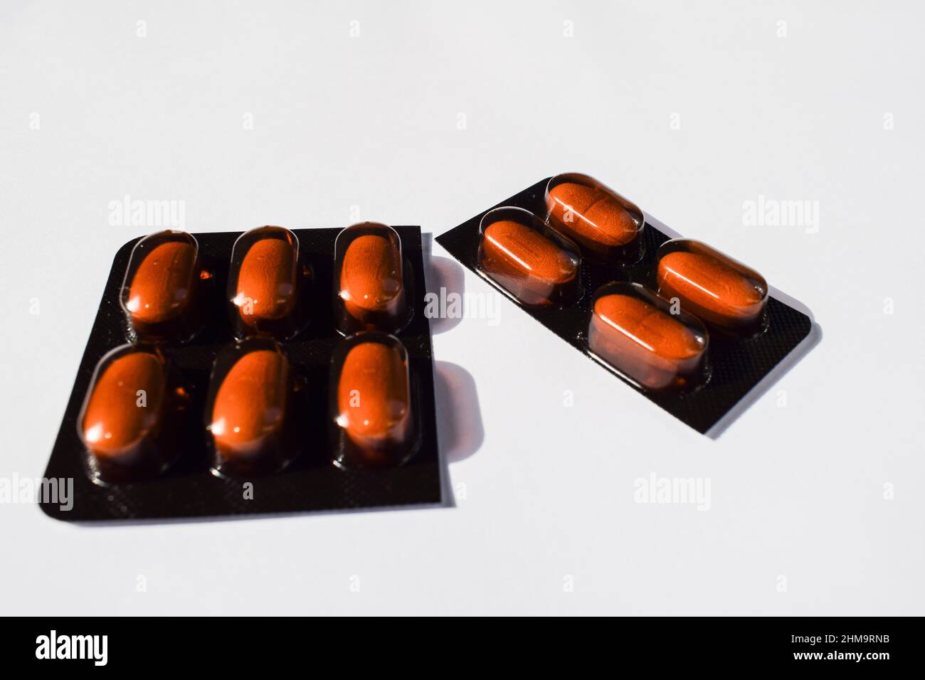 Medicine strips of 10 tablets in brown color packet cut with scissors ...