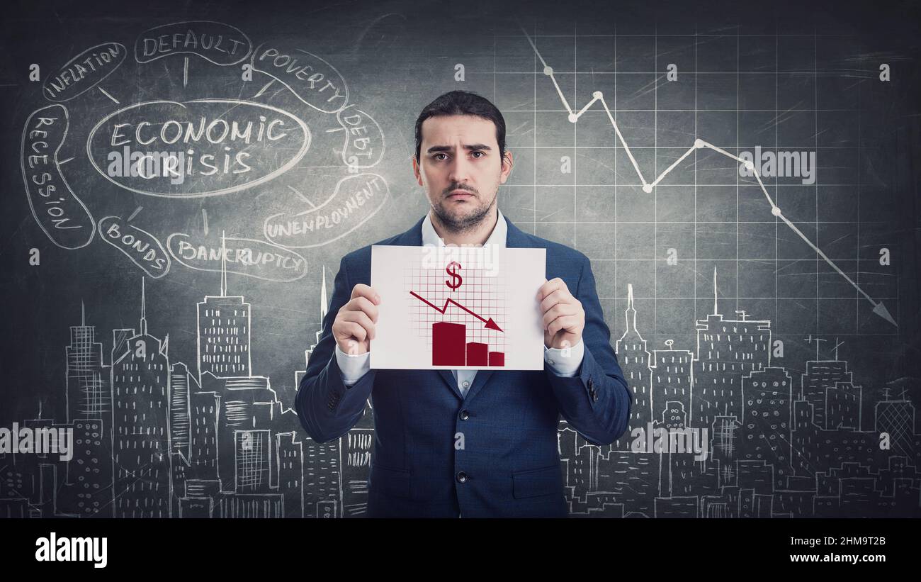 Stressed and upset businessman holding a paper sheet with negative ...