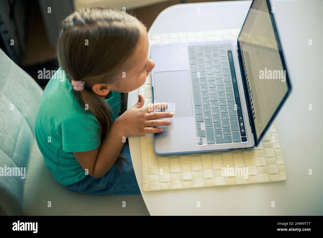 Little cute girl uses laptop to have video call Stock Photo - Alamy