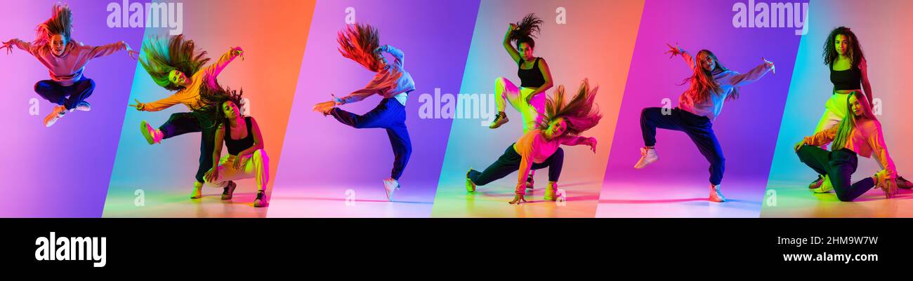 Two young girls, dancing contemporary dance on gradient pink purple ...
