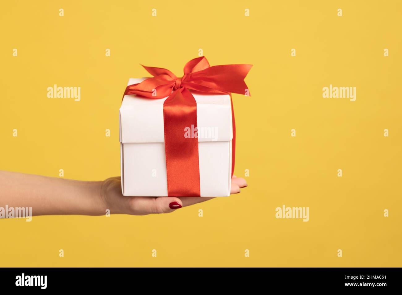 Hand giving present hi-res stock photography and images - Alamy