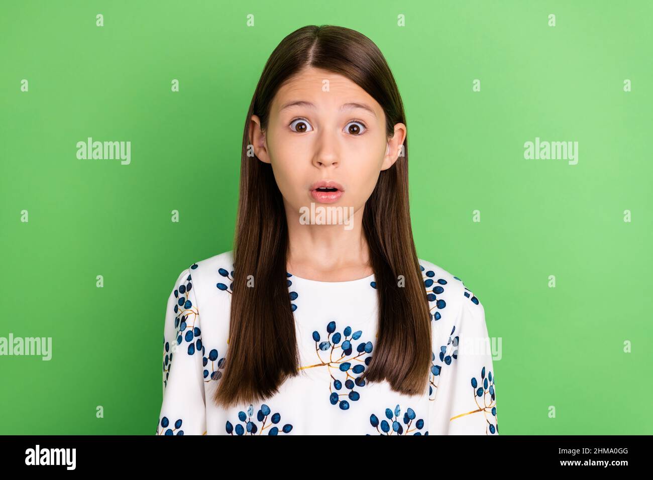 Portrait of impressed schoolkid girl stupor horror movie watching ...