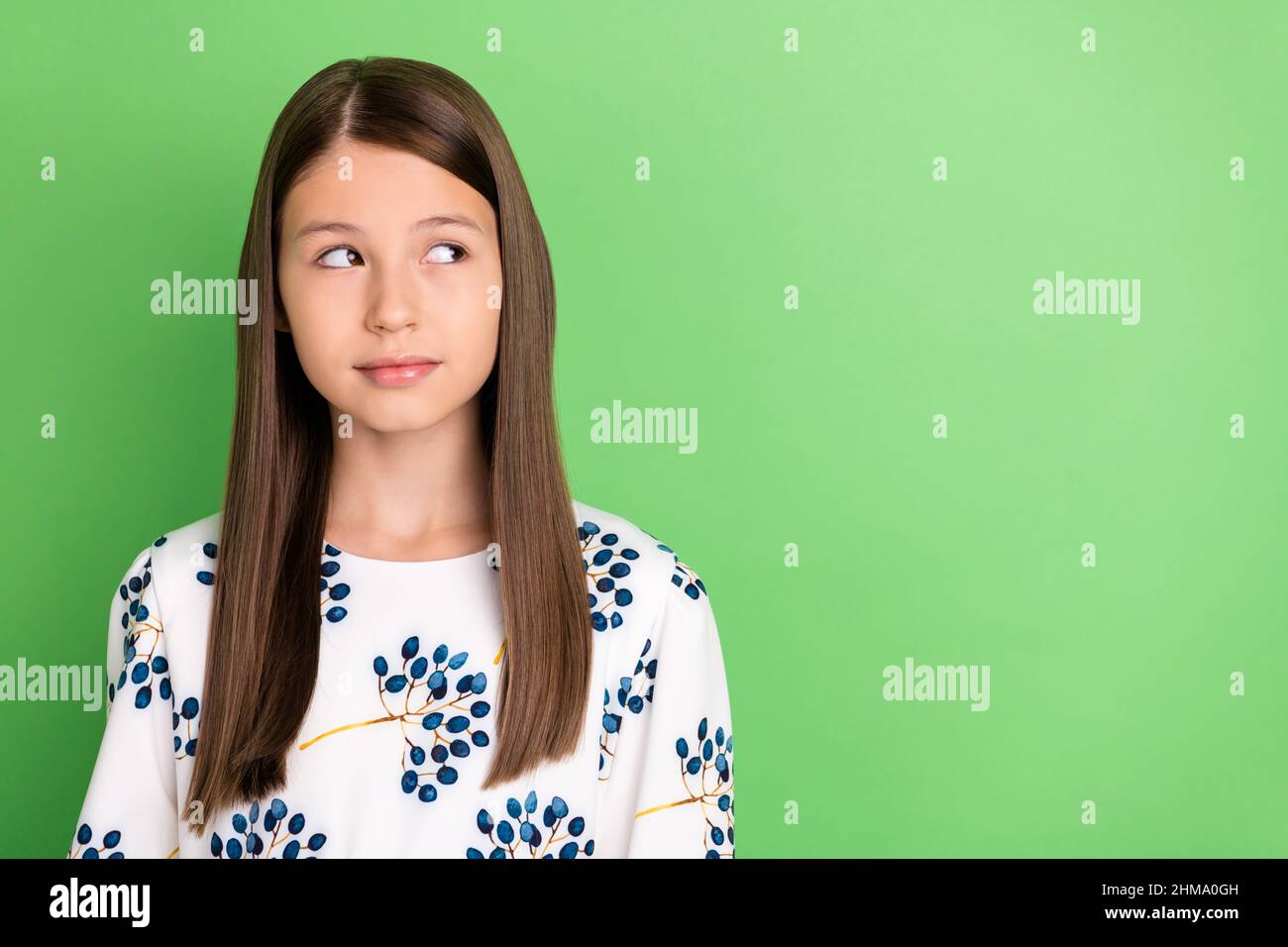 Photo of interested schoolkid girl look empty space think decide ...
