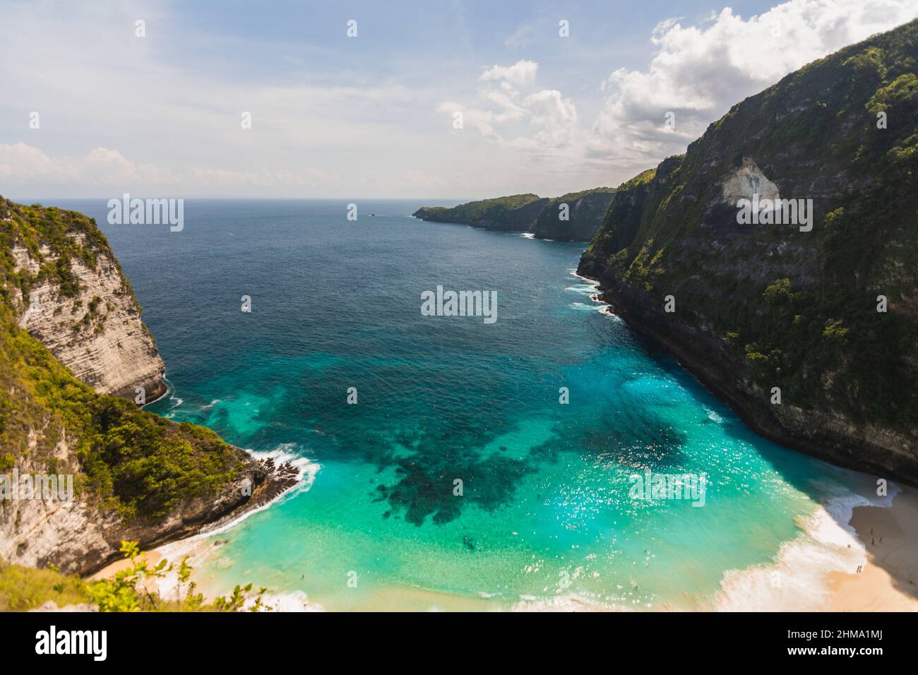 Scenic seascape of rocky steep rocky coast and sandy beach washed by ...