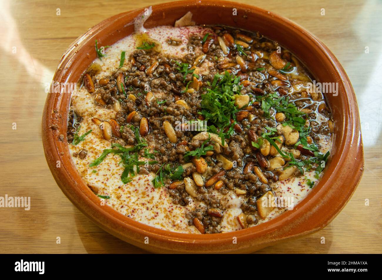 Traditional Levantine ‘fatteh’ dish made of flatbread covered with ...