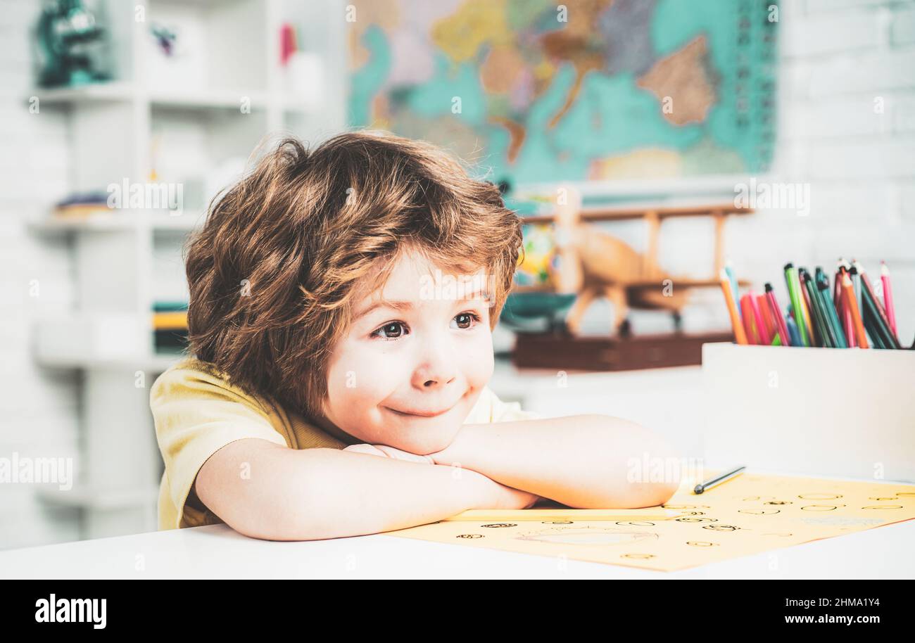 Beginning of lessons. Kid is learning in class on background of ...