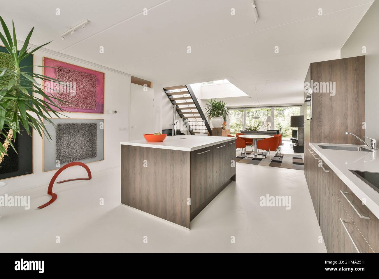 Interior of modern spacious kitchen with island counter and built in ...