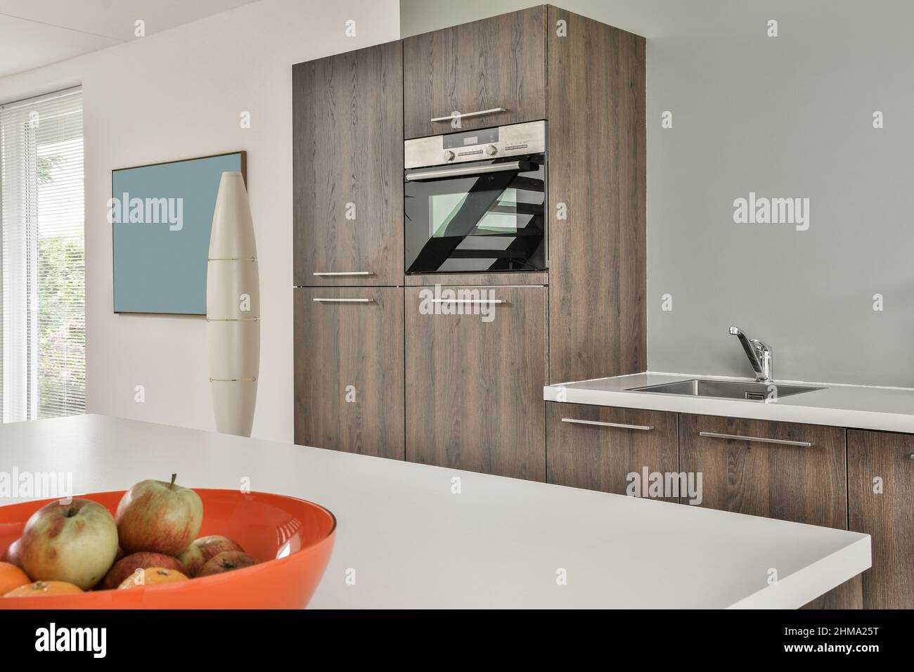 Interior of modern spacious kitchen with island counter and built in ...