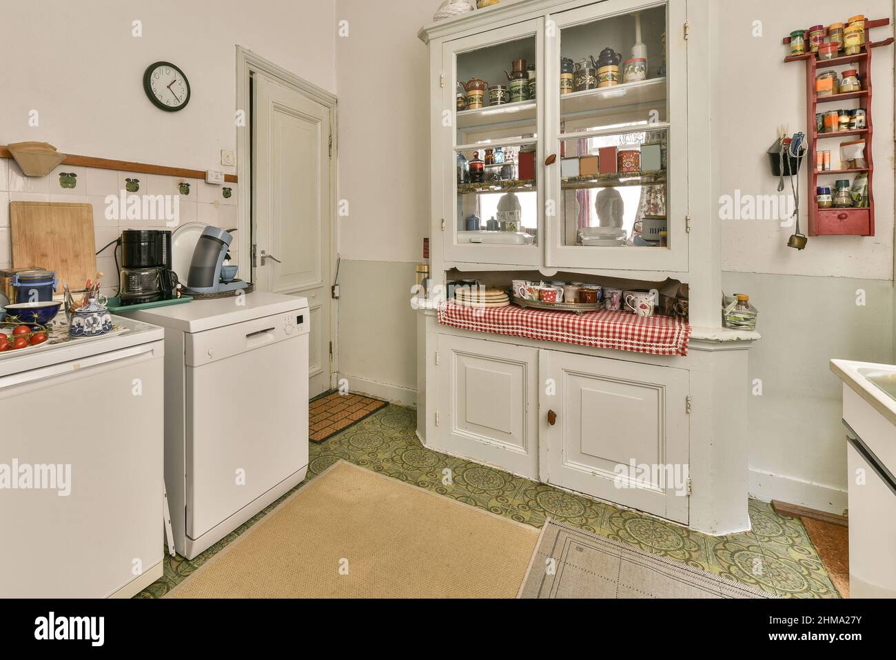 Interior of old fashioned kitchen with appliances and wooden cabinets ...