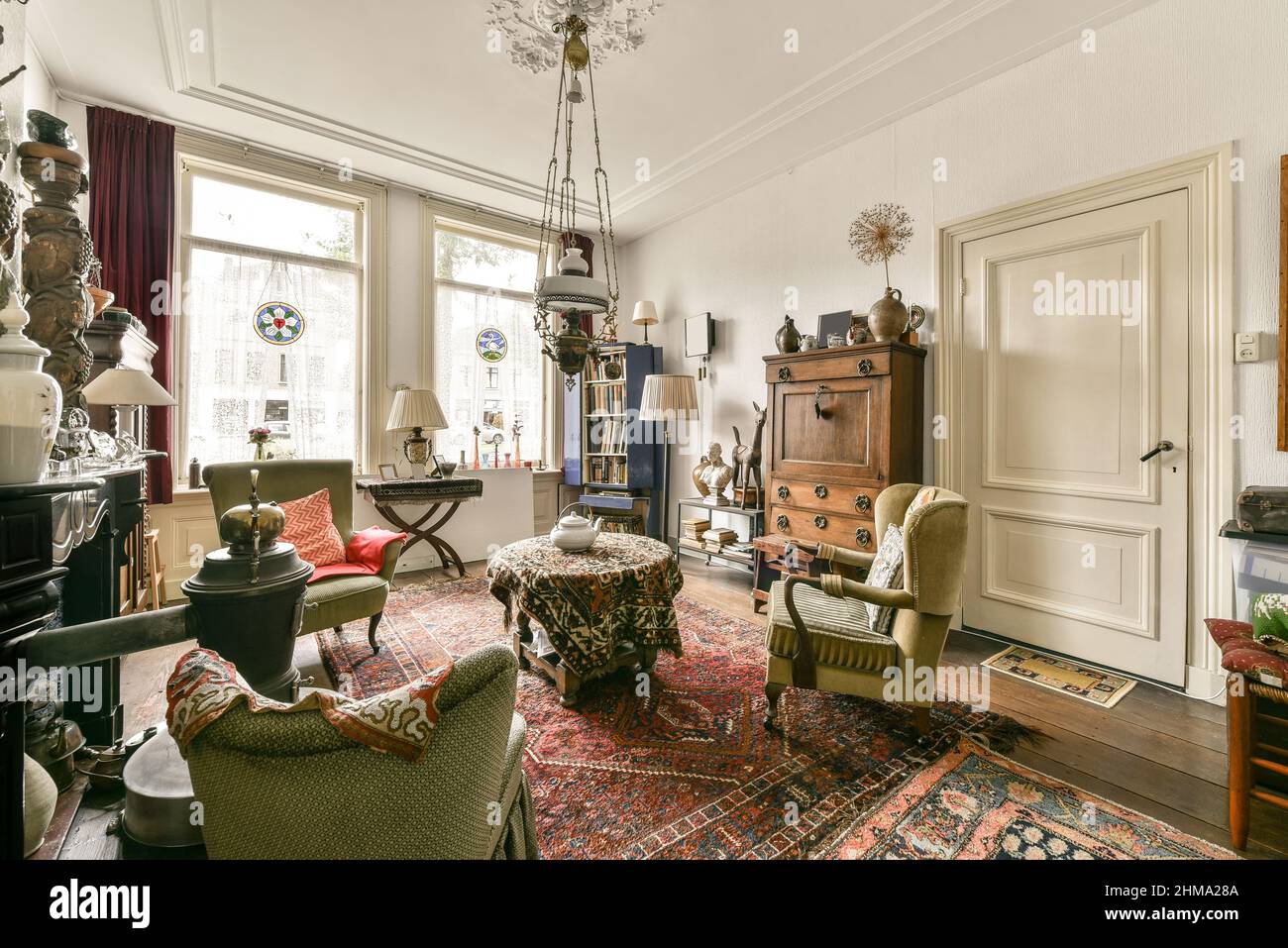 Interior of spacious lounge zone with old fashioned furniture designed ...