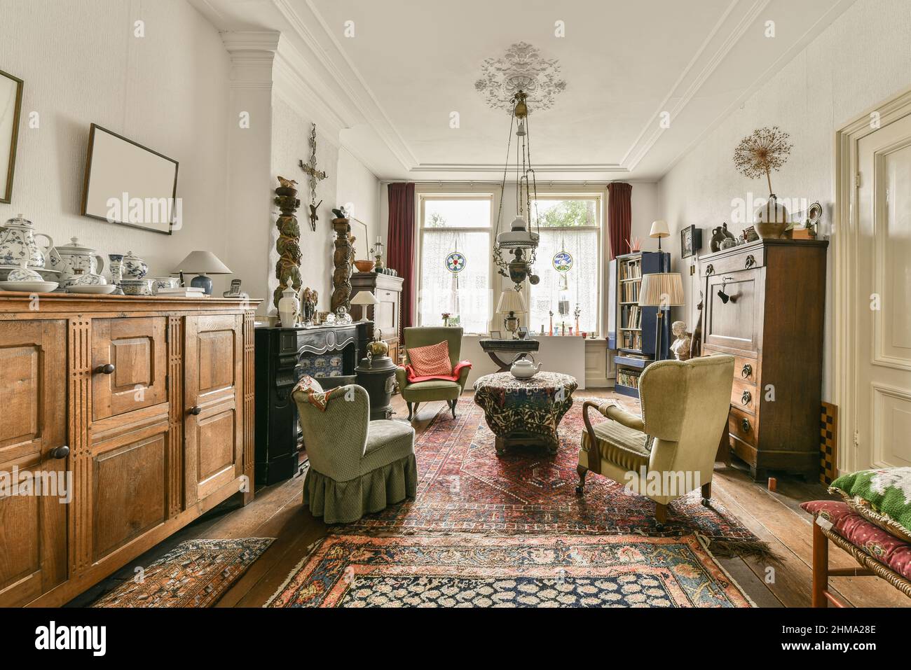 Interior of spacious lounge zone with old fashioned furniture designed ...