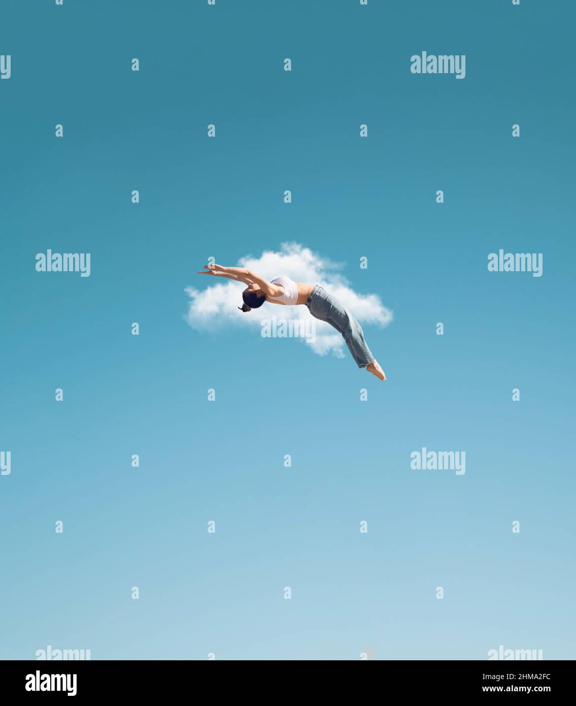 Full body side view of faceless sporty female acrobat doing somersault ...