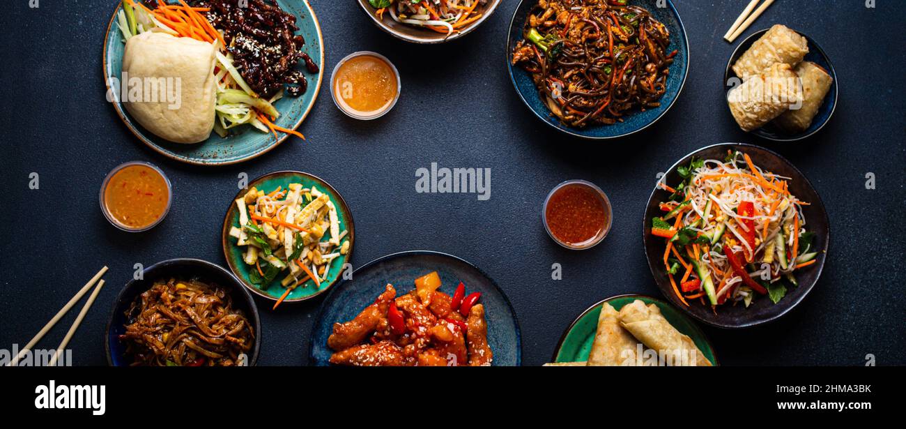 Set of Chinese dishes on table space for text Stock Photo - Alamy
