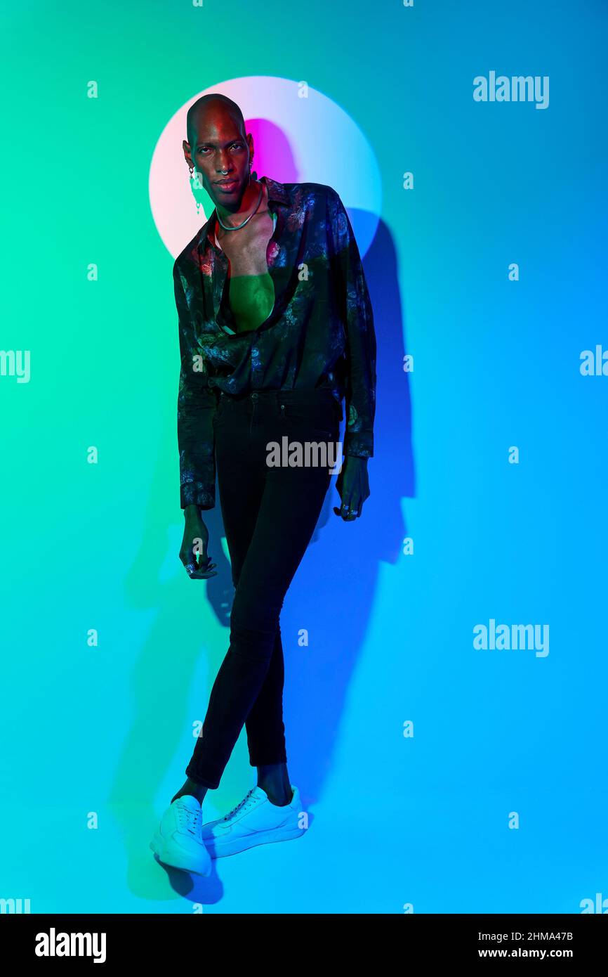 Full body of serious African American female astronaut in spacesuit ...