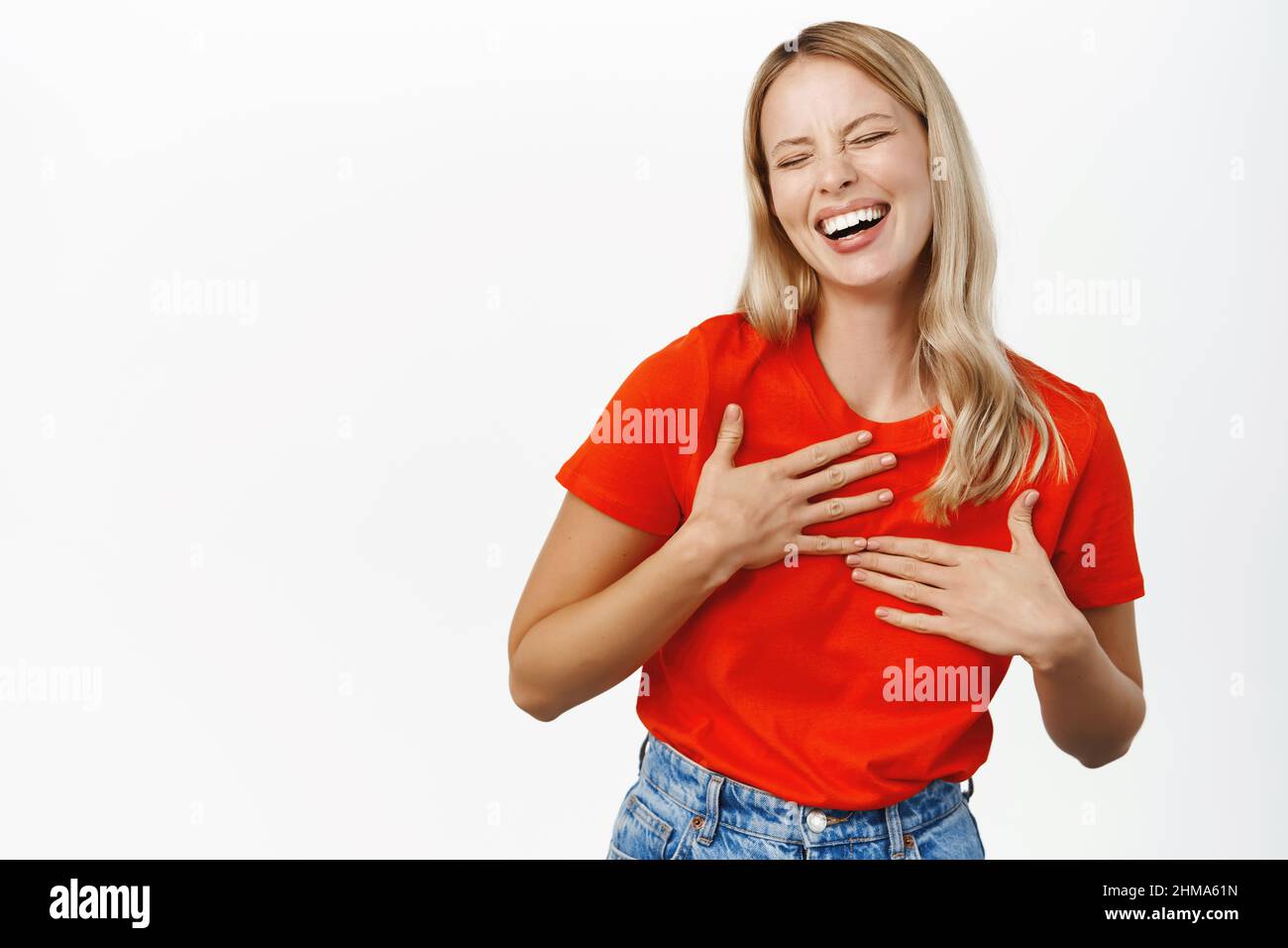 Portrait of authentic happy blond woman, laughing and smiling carefree ...