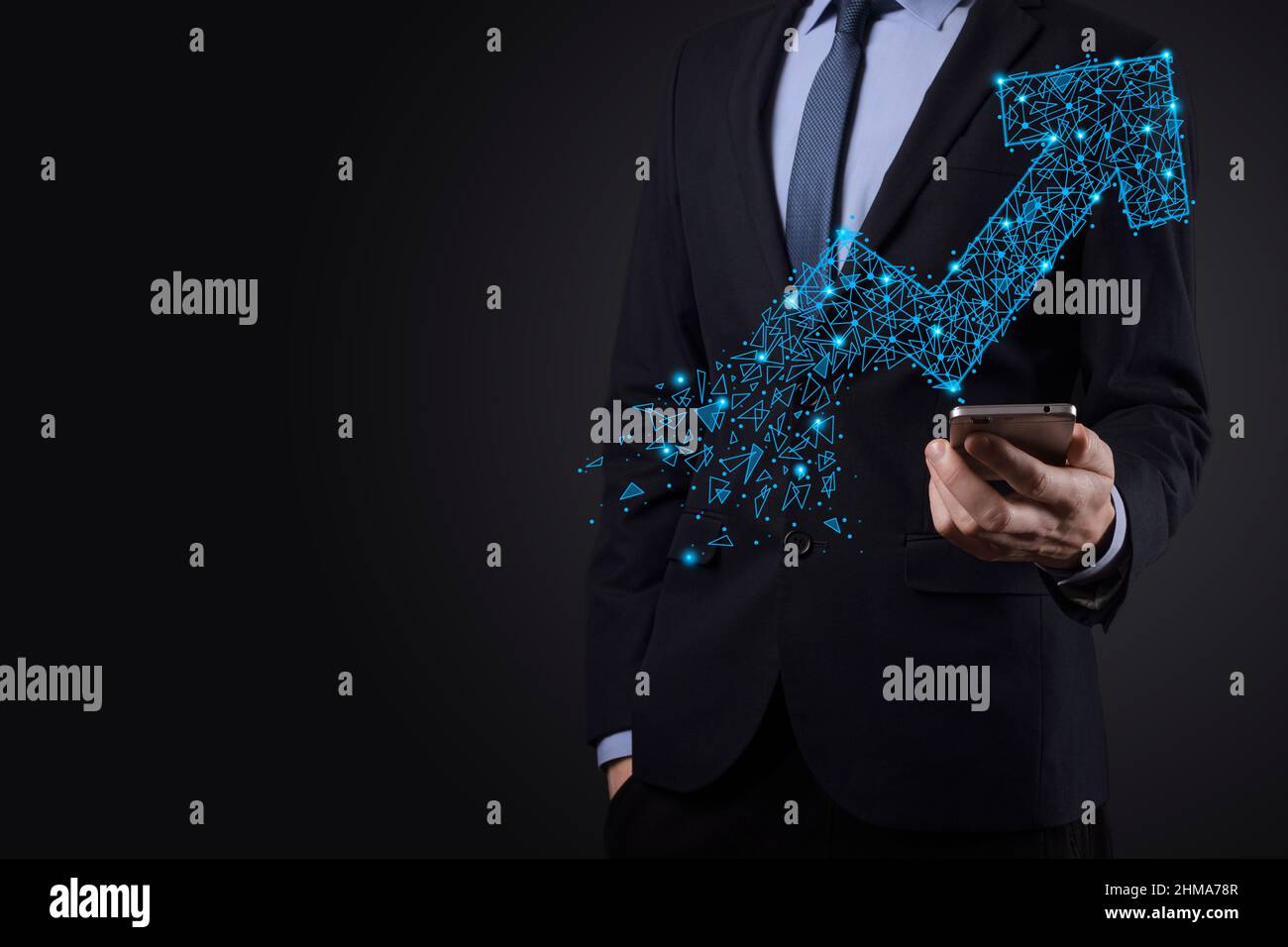 Businessman hold graph, arrow of positive growth icon.pointing at ...