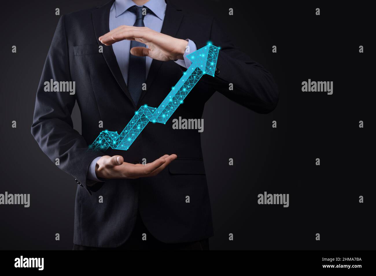 Businessman hold graph, arrow of positive growth icon.pointing at ...