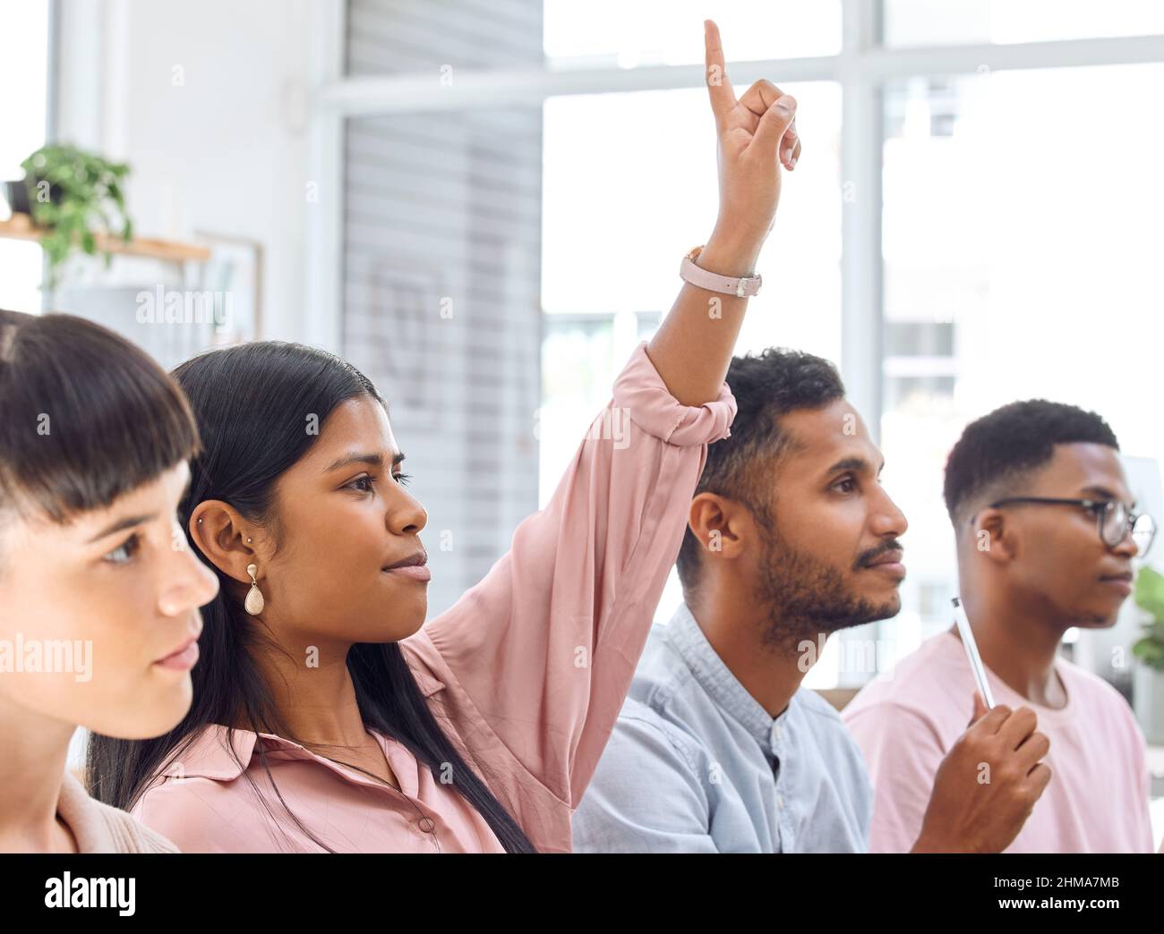 Woman raising hand volunteer hi-res stock photography and images - Alamy