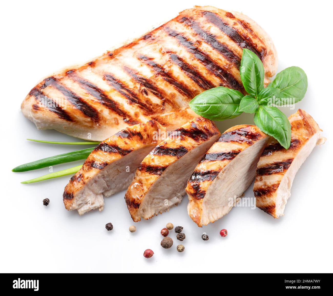 Grilled chicken fillet with herbs isolated on white background Stock ...