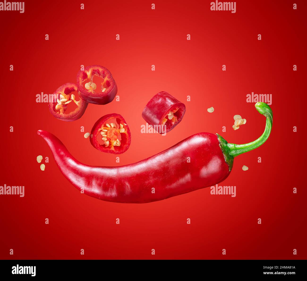 Fresh red chilli pepper and cross sections of chilli pepper with seeds ...