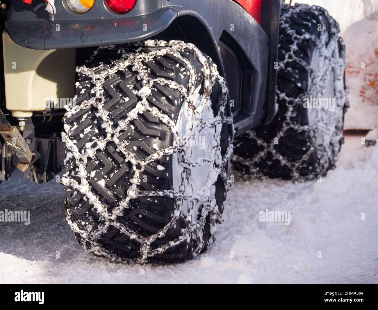 Wheels with snow chains on the vehicle for clearing snowy roads - snow ...