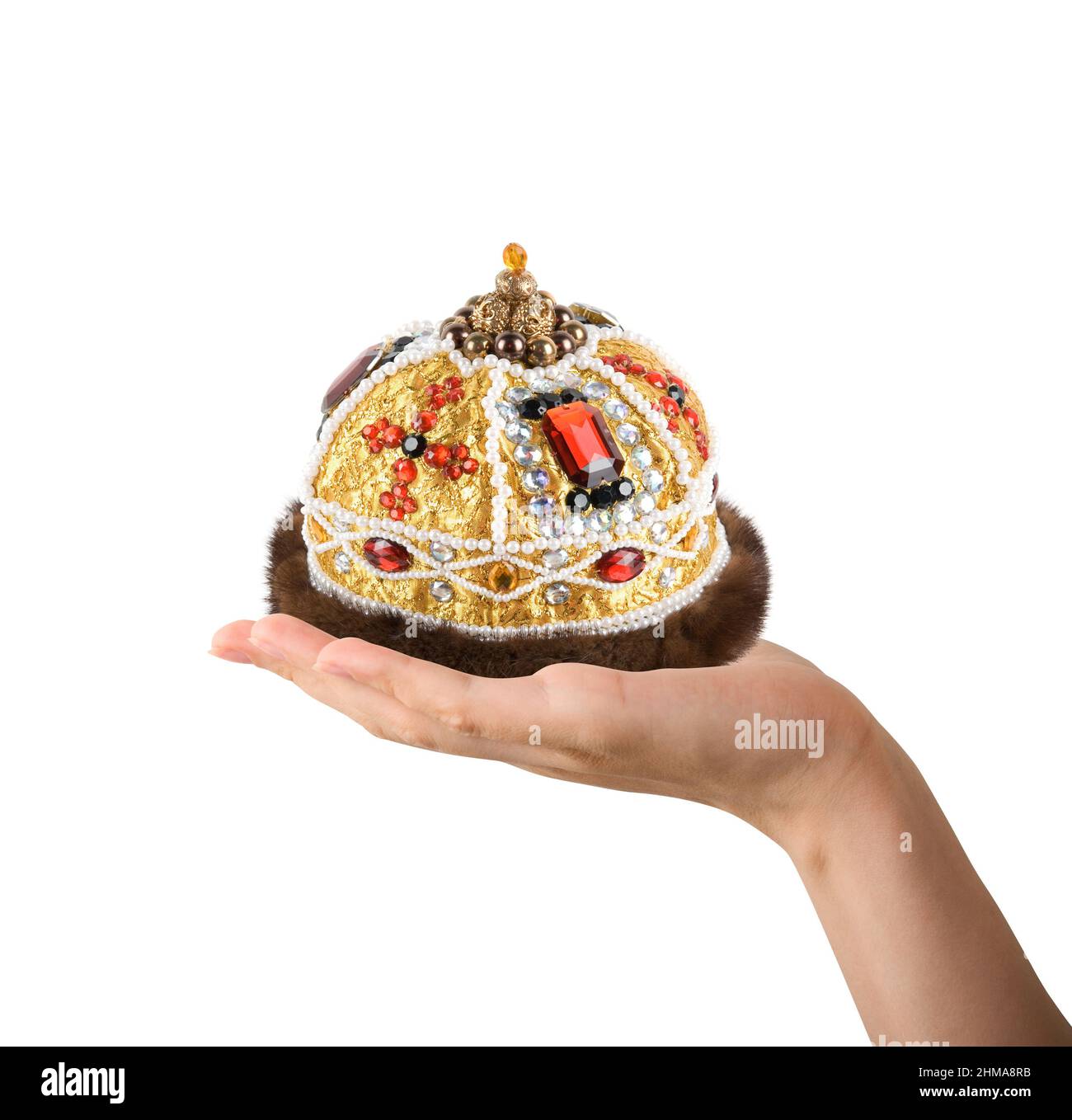 Woman's hand holding a gold crown over white background. Medieval ...