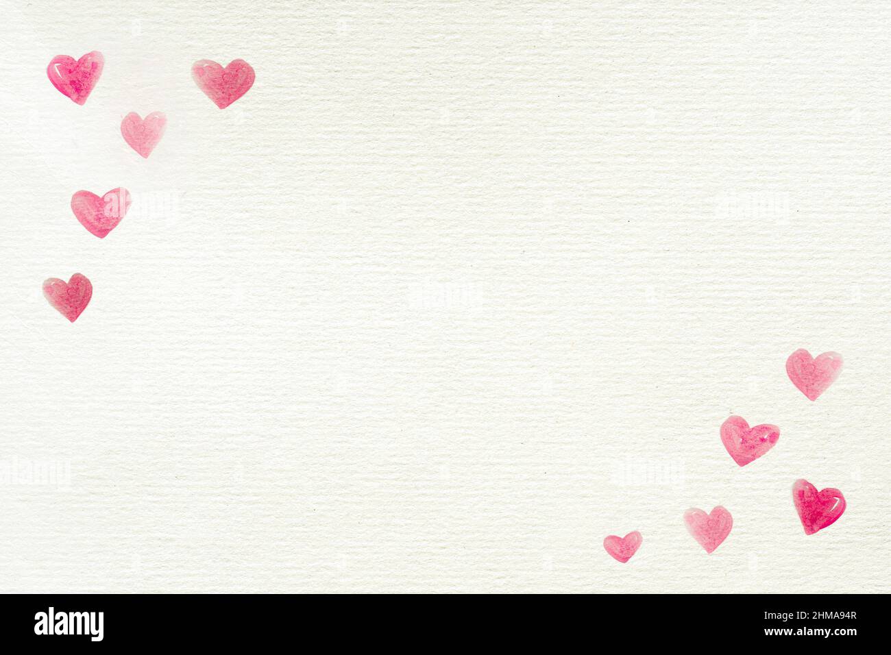 Love background with hearts painted in the corners on a recycled white ...