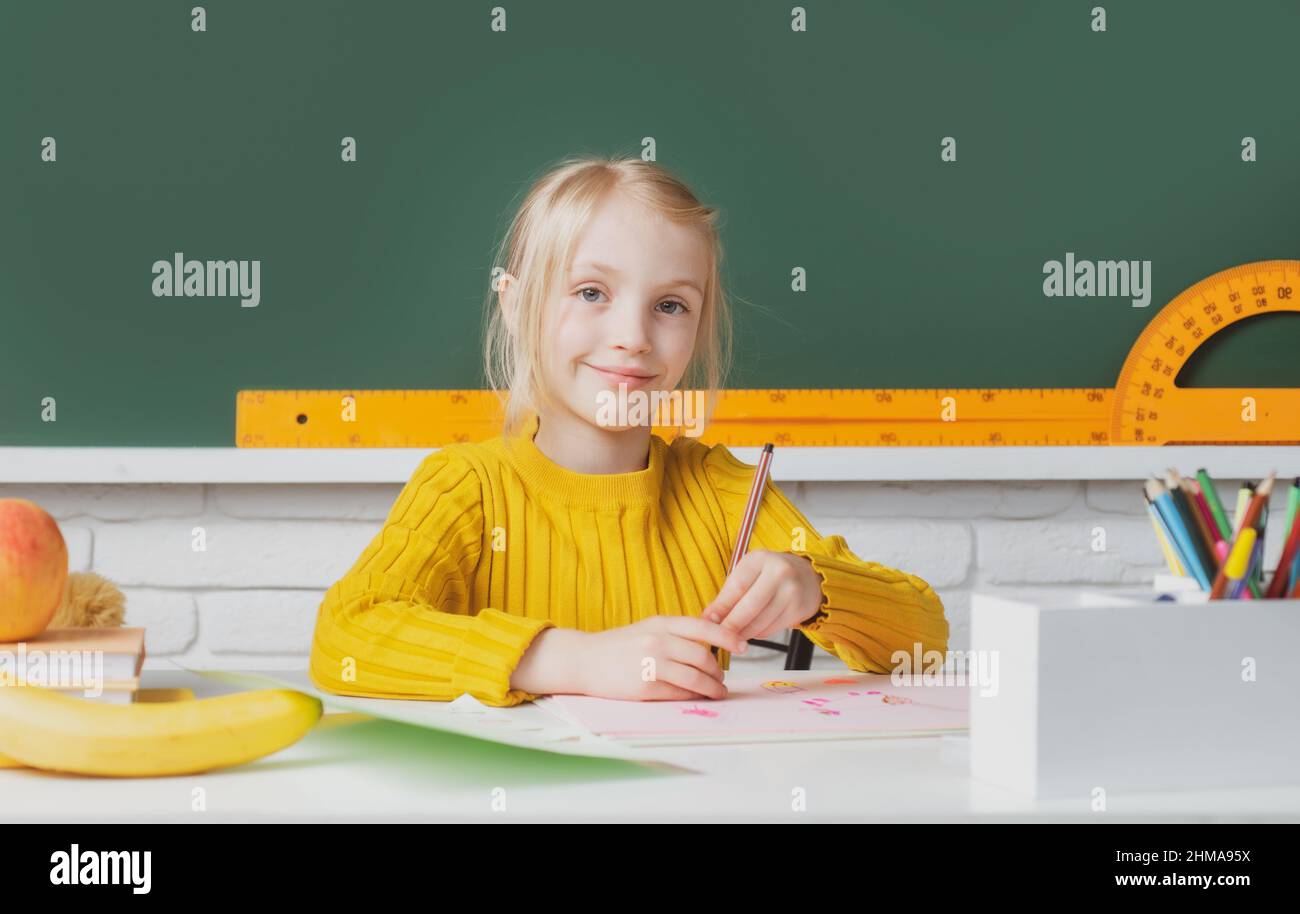 School girl studying math on lesson in classroom at elementary school ...
