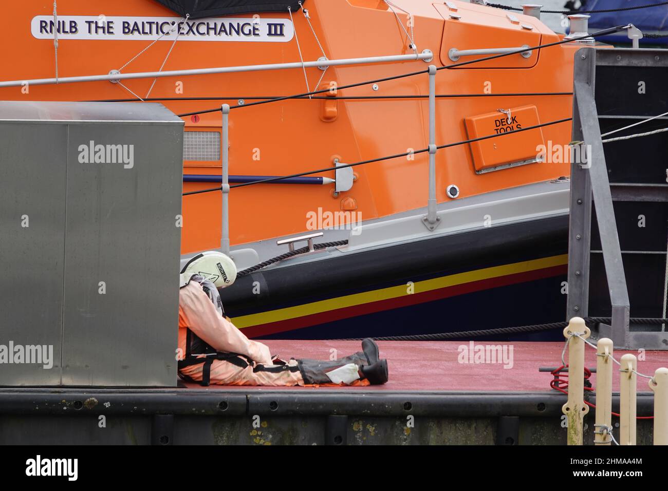 A boat of the Royal National Lifeboat Institute RNLI in harbour with an ...