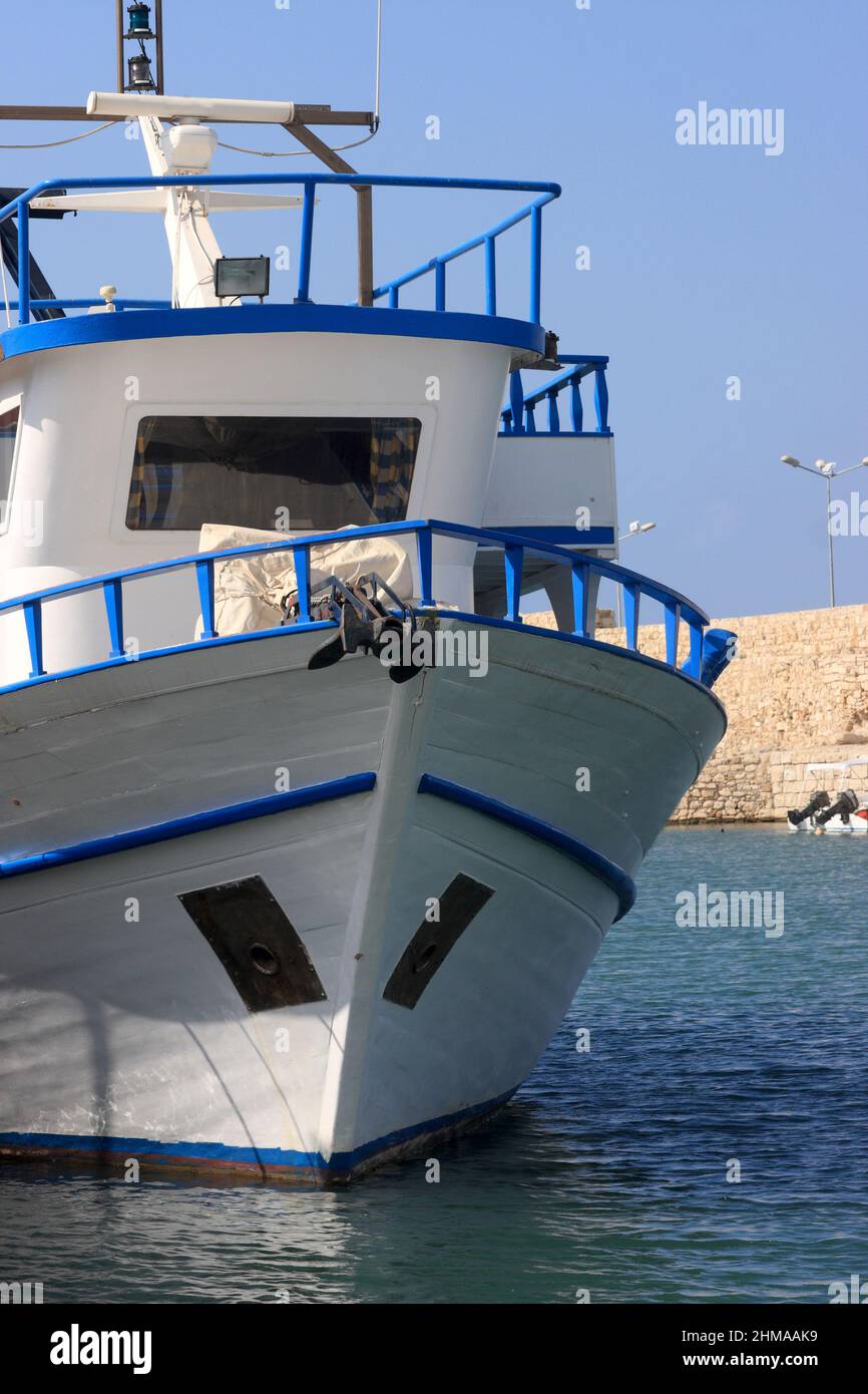 White ship is anchored in harbor of Retimo, crete Stock Photo - Alamy