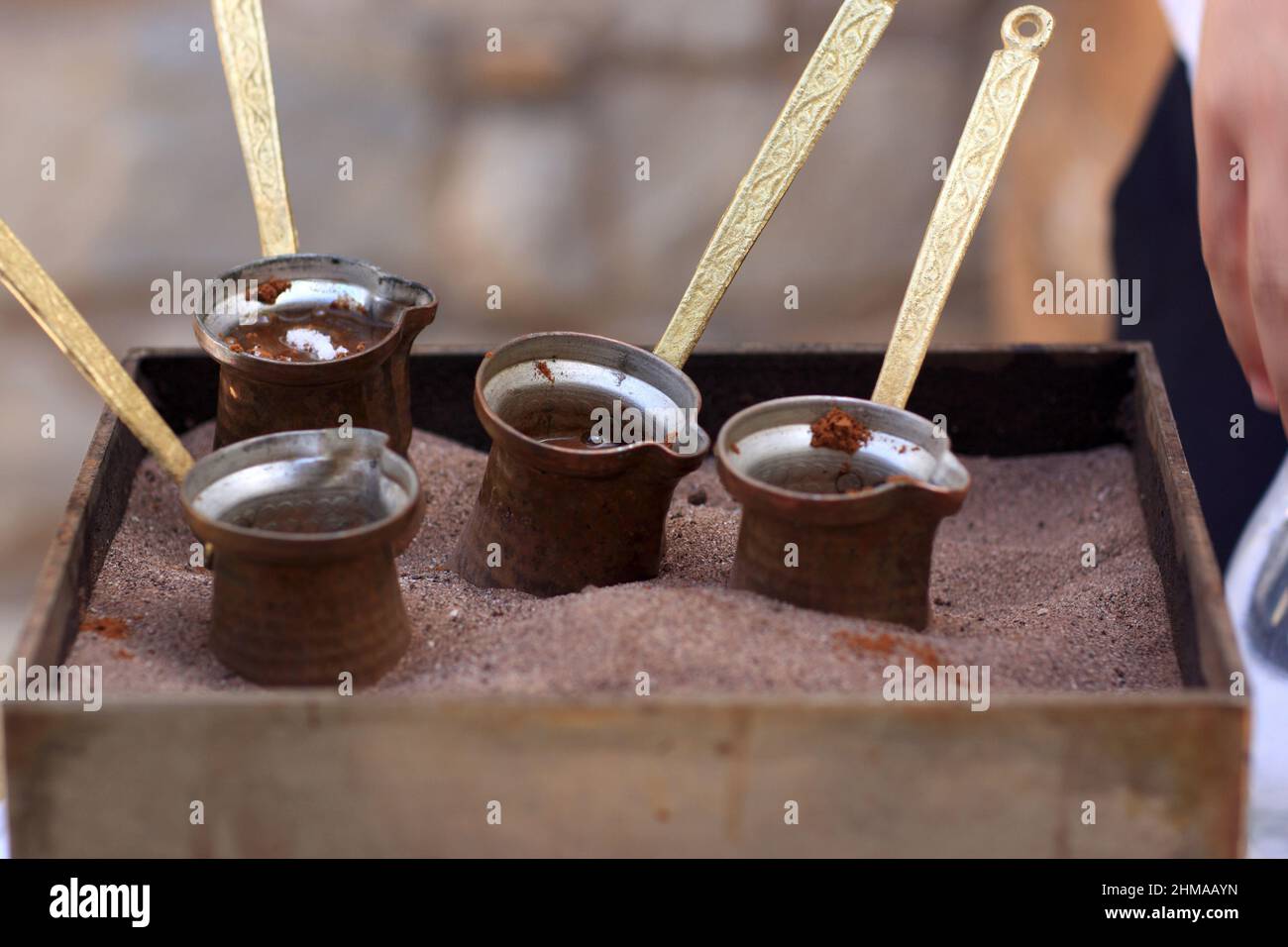 Four coffee pots in the sand, greece Stock Photo - Alamy